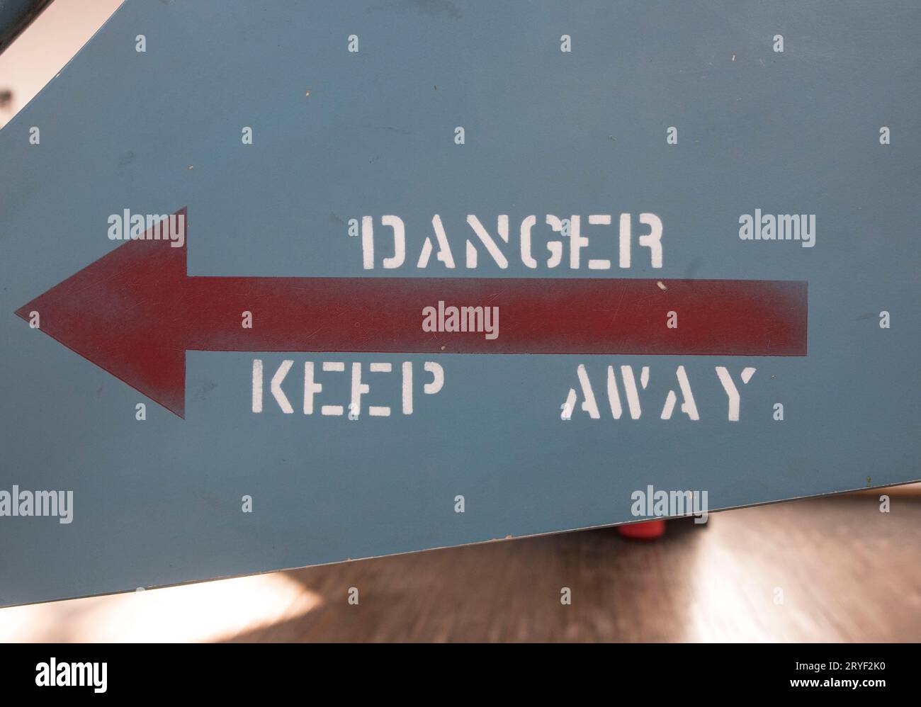 Direction arrow points in one way Stock Photo - Alamy