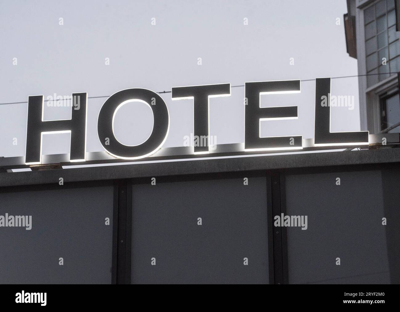 Illuminated Hotel sign at the entrance Stock Photo - Alamy