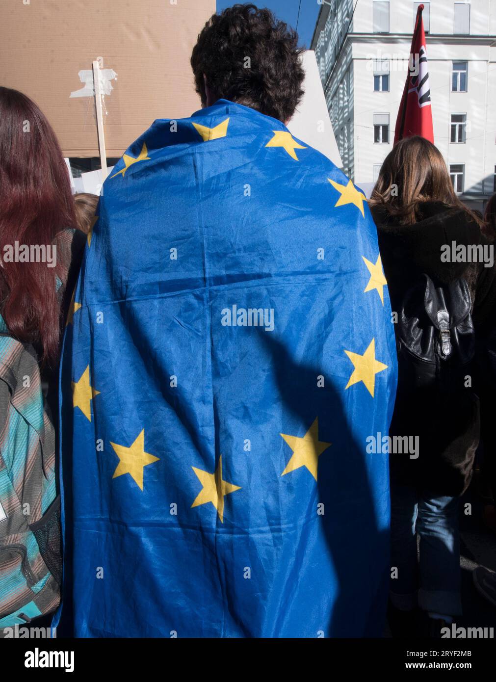 EU citizens with blue European Union flag Stock Photo - Alamy