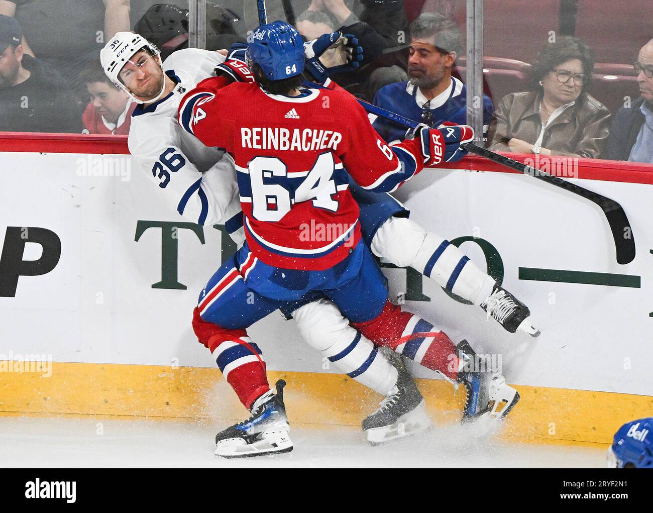 Montreal Canadiens' David Reinbacher checks Toronto Maple Leafs' Josiah ...