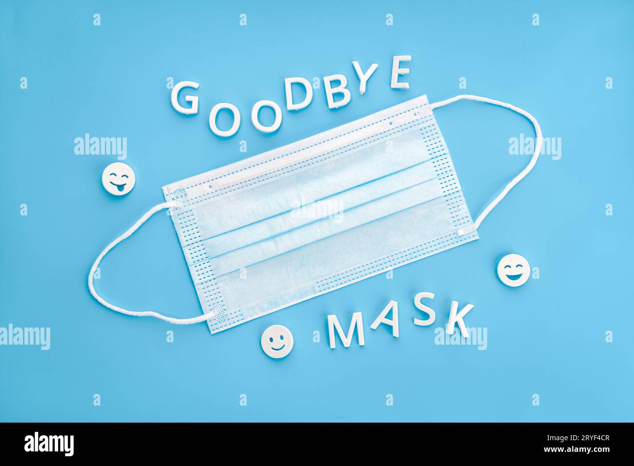 Goodbye mask phrase and face mask isolated on blue background. Concept ...