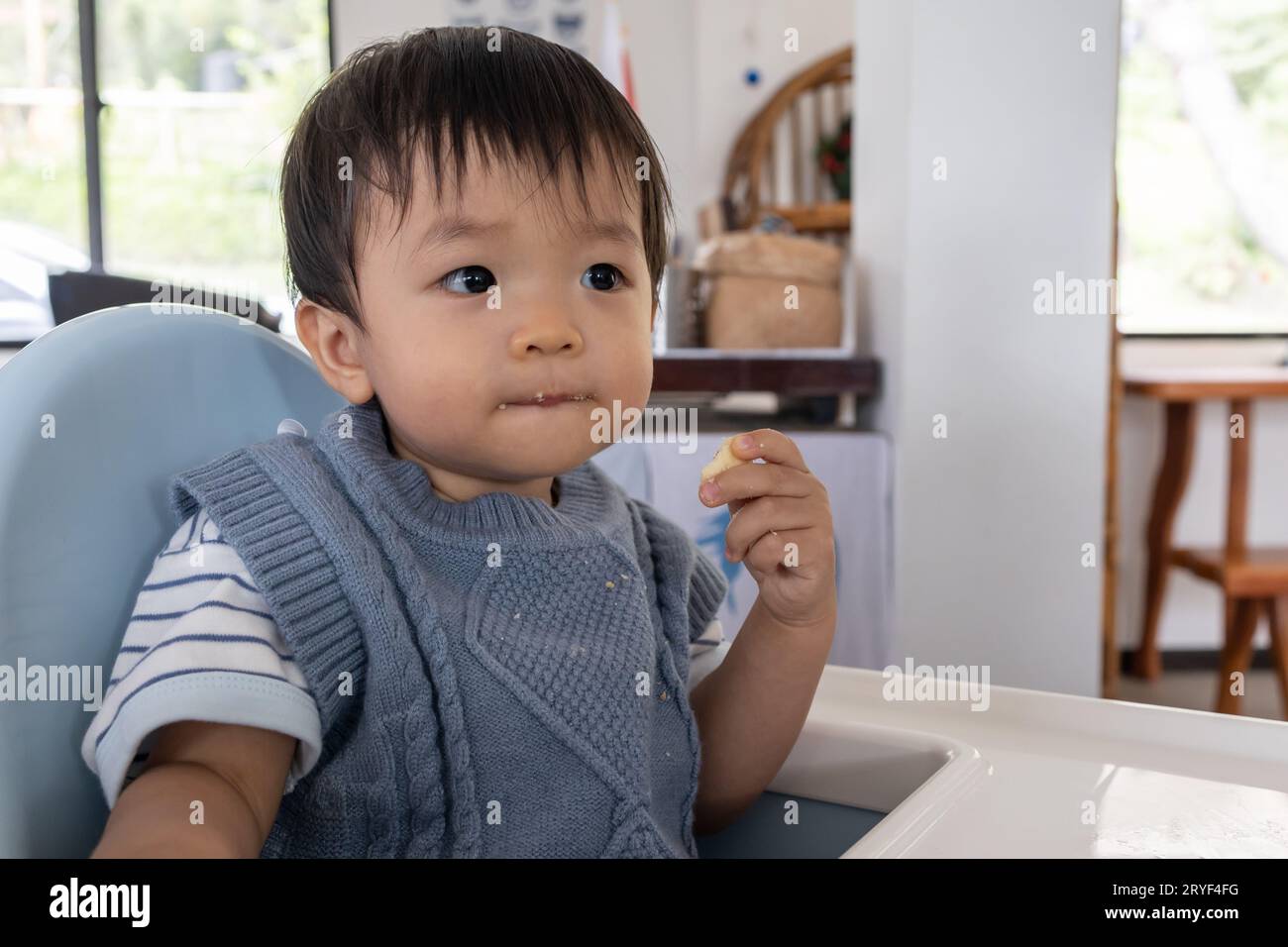 Portrait image of 1-2 years old childhood child. Face of relax and happy Asian boy in head shot ...