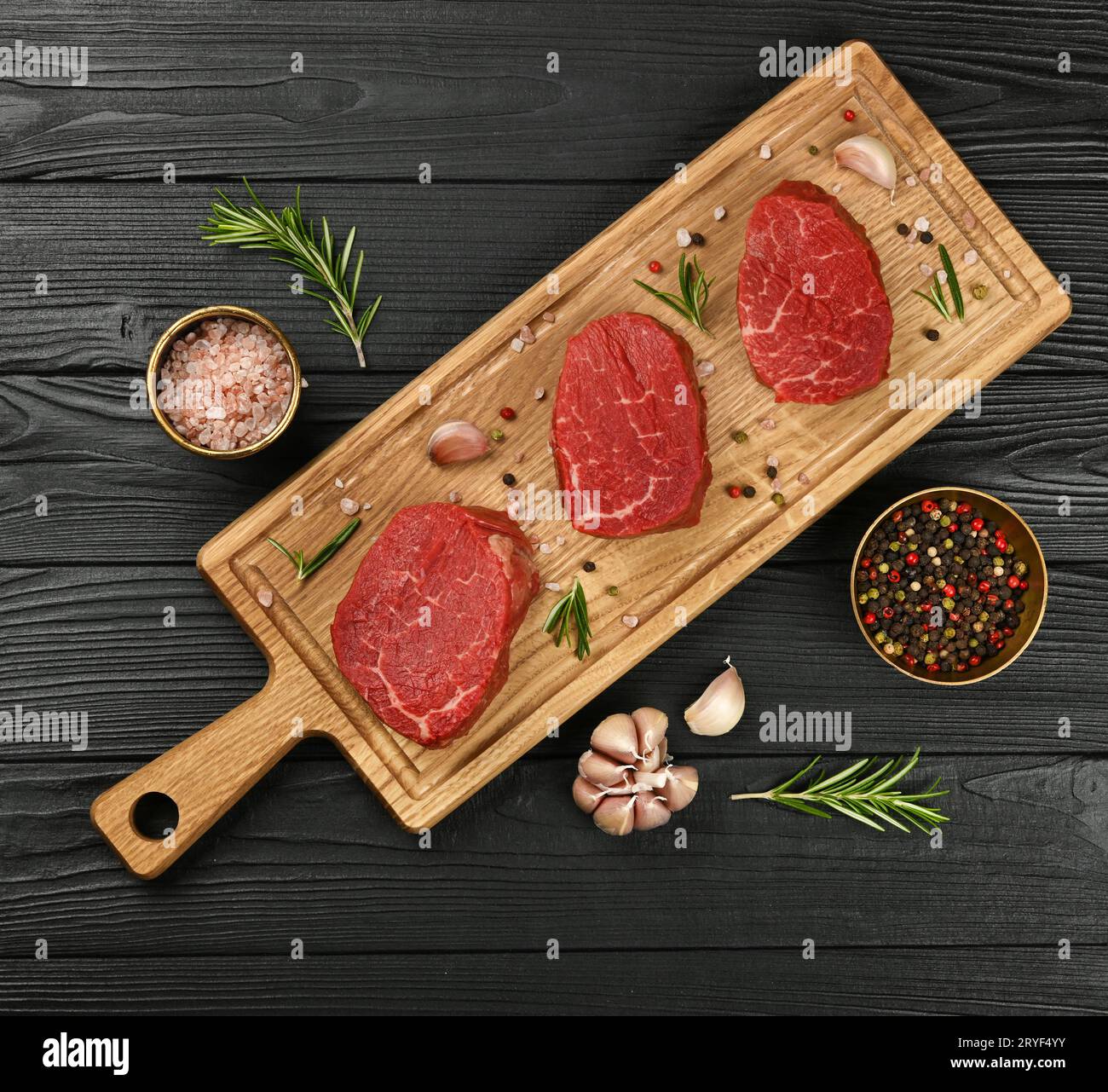 Close up raw beef tenderloin steak on board Stock Photo - Alamy