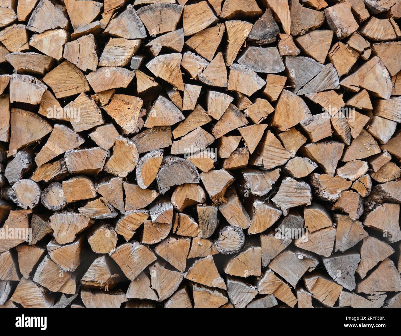Stack pile of firewood oak wooden logs Stock Photo - Alamy