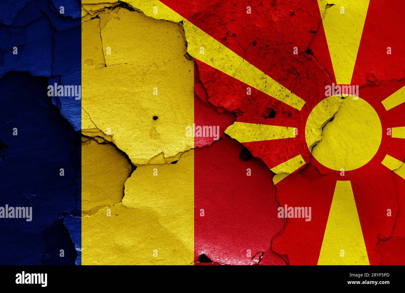 Flags of Romania and North Macedonia painted on cracked wall Stock ...