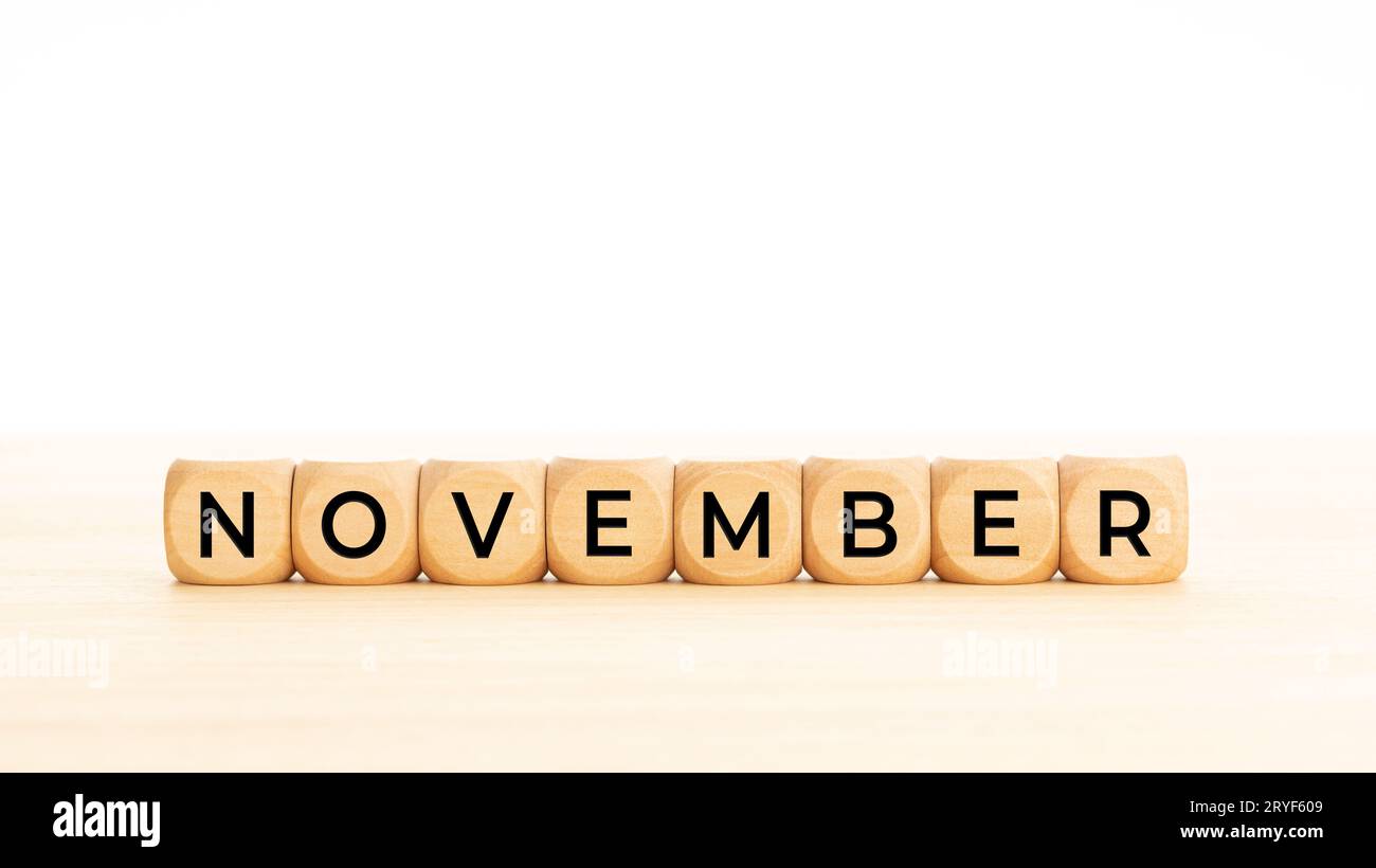 November word on wooden blocks. Copy space. White background Stock ...