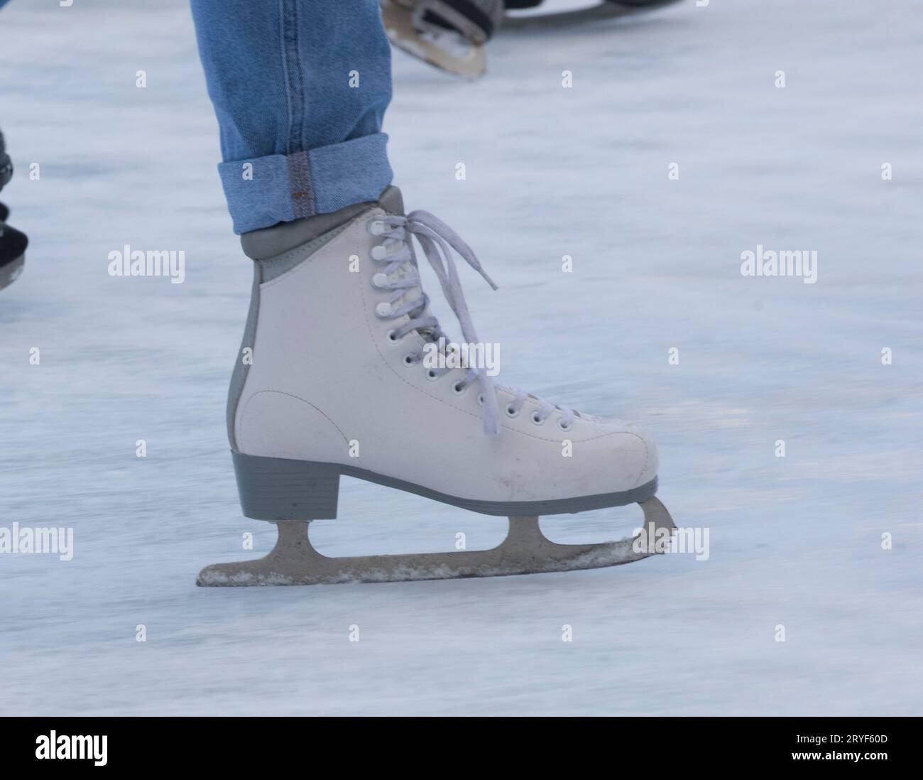 Ice skating in winter on a skating rink Stock Photo - Alamy