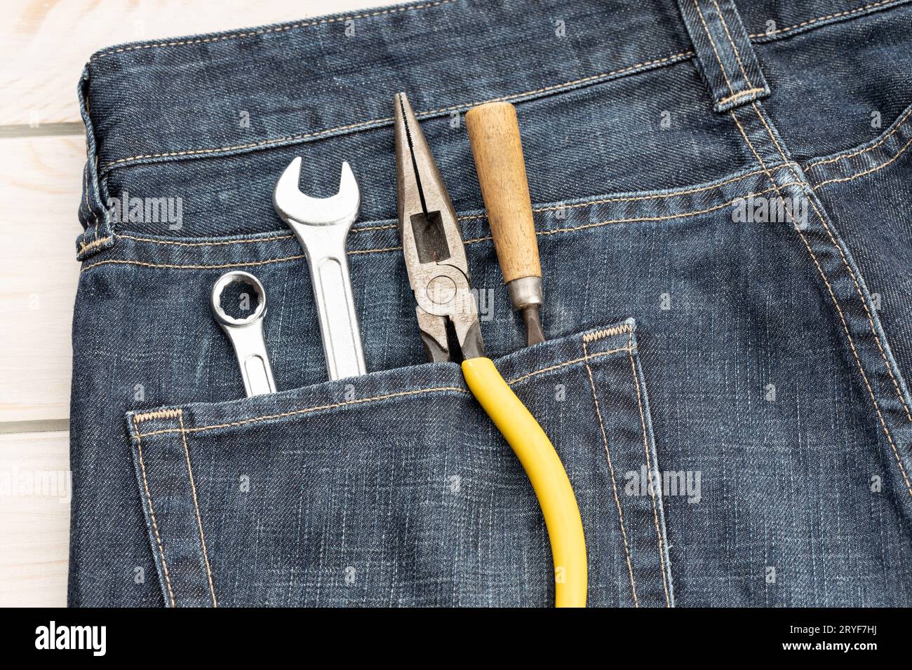 Set of tools in in jeans pocket. Labor day background concept Stock ...