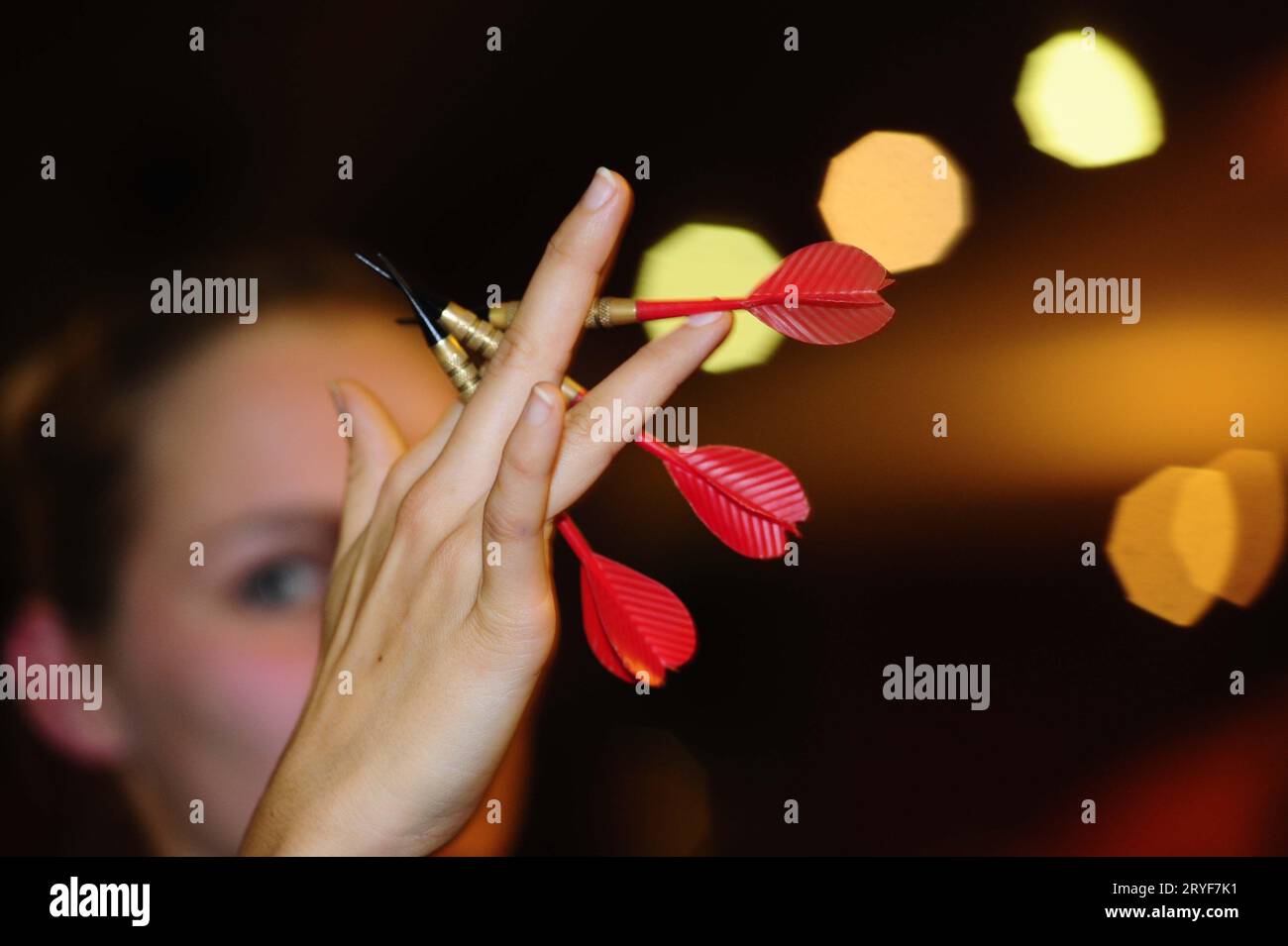 Holding darts in the hand Stock Photo - Alamy