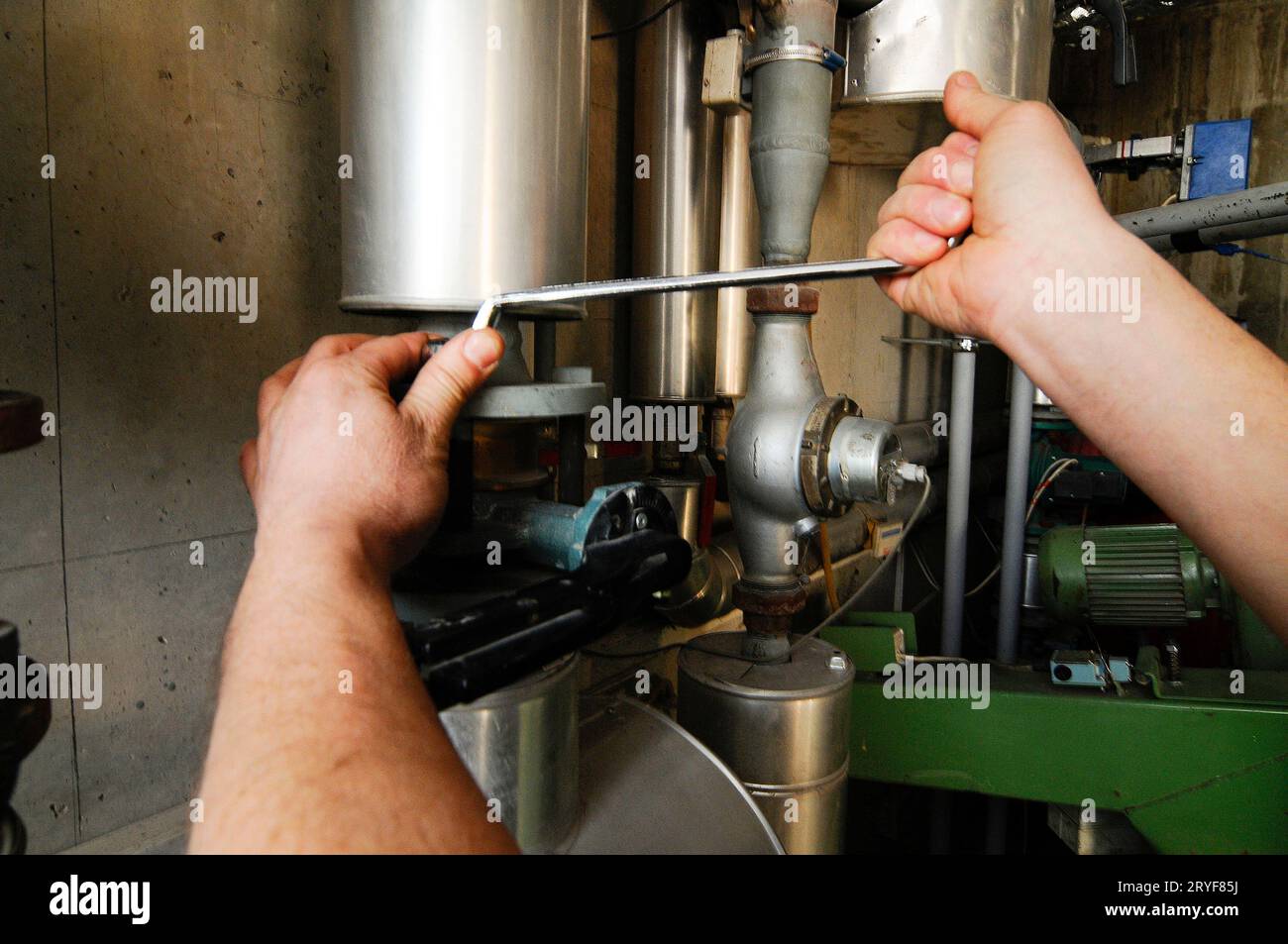 Repair of a heating system Stock Photo - Alamy