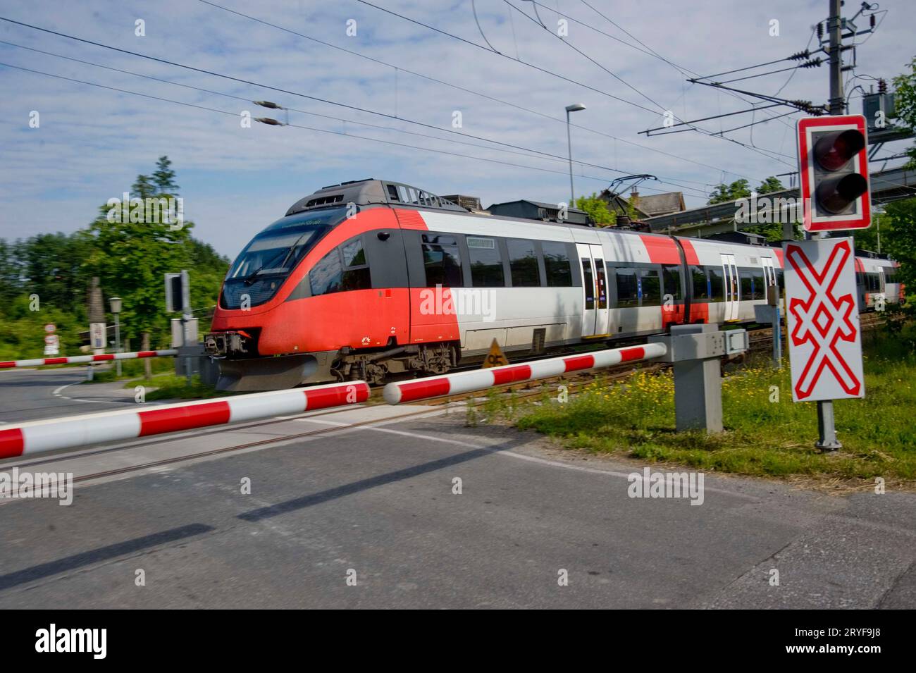 Railway crossing gate on the street Stock Photo - Alamy Railway crossing gate on the street Stock Photo - Alamy