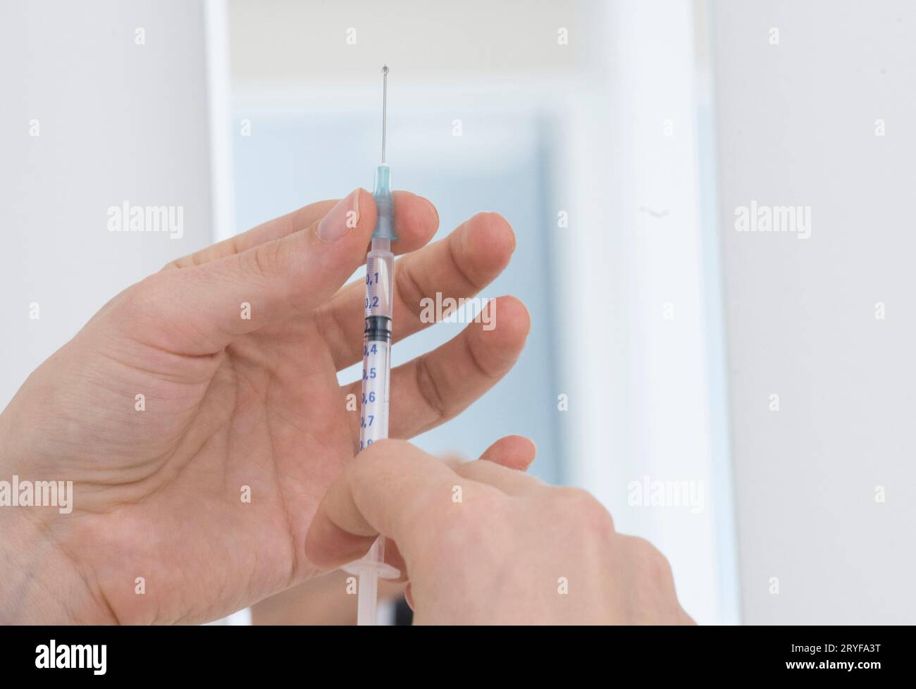 Vaccination by injection with a syringe Stock Photo - Alamy