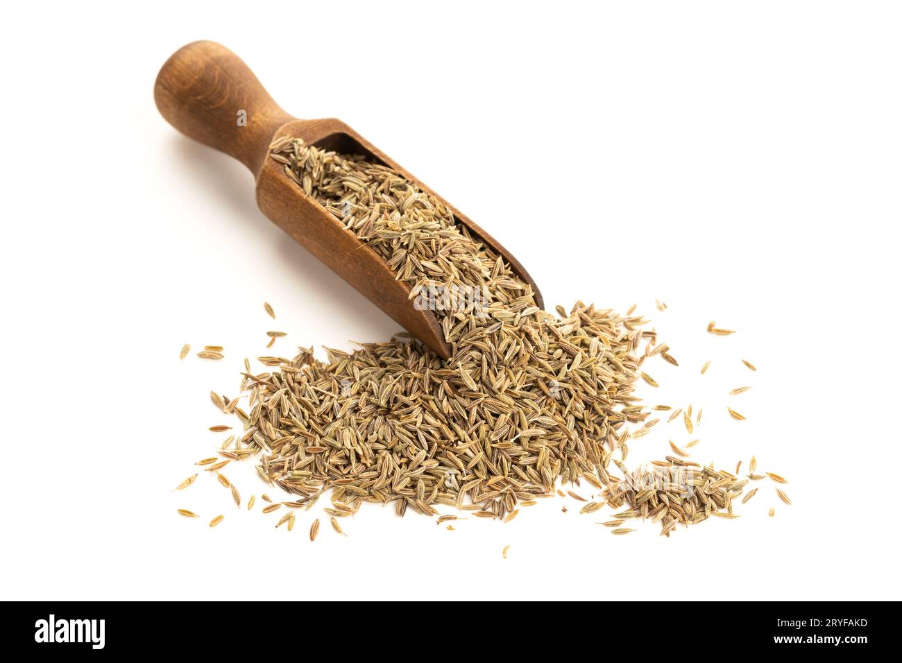 Cumin seeds on wooden spoon isolated on white background. Cuminum ...