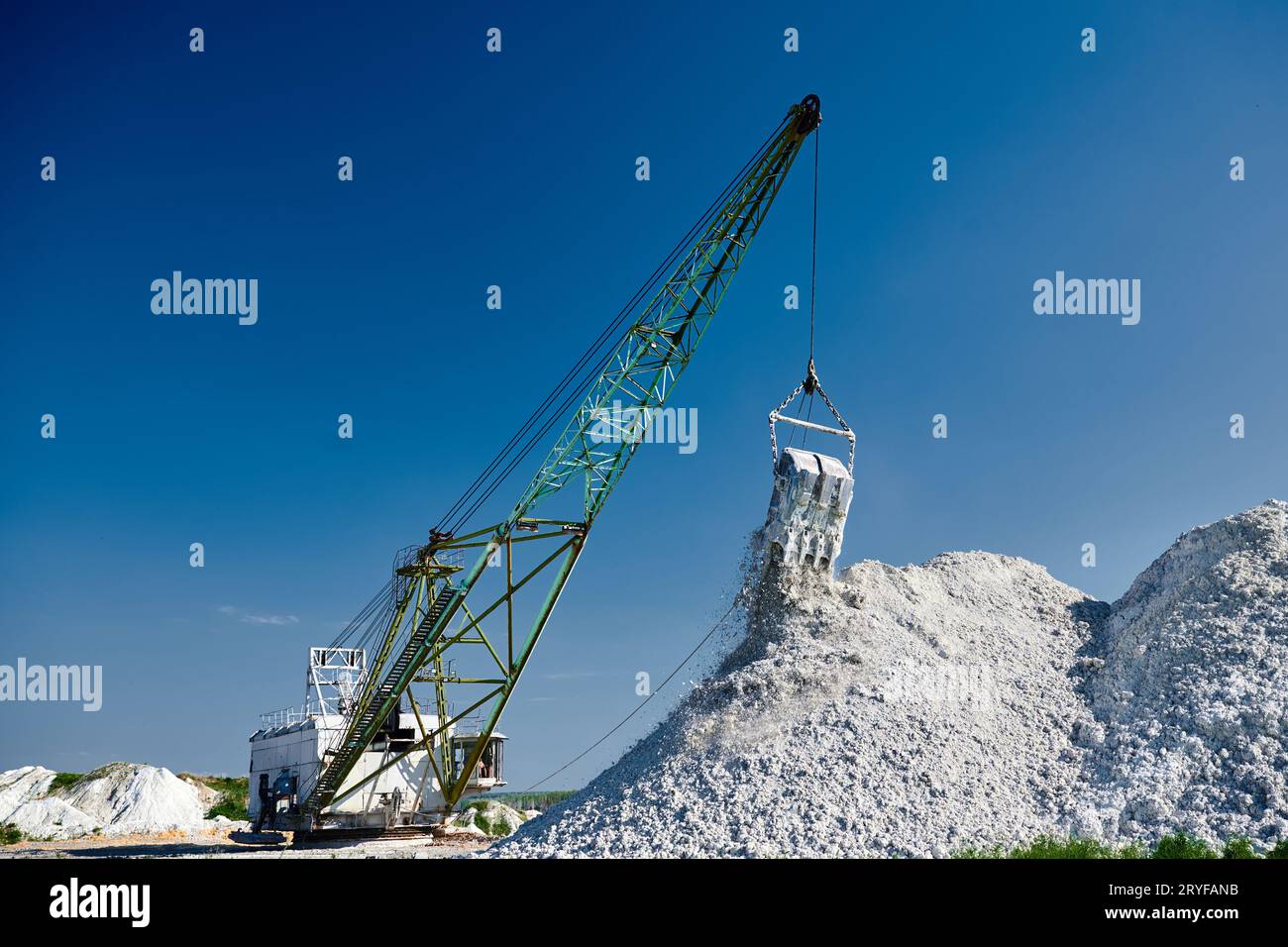 Walking excavator in process of chalk mining in open quarry Stock Photo ...