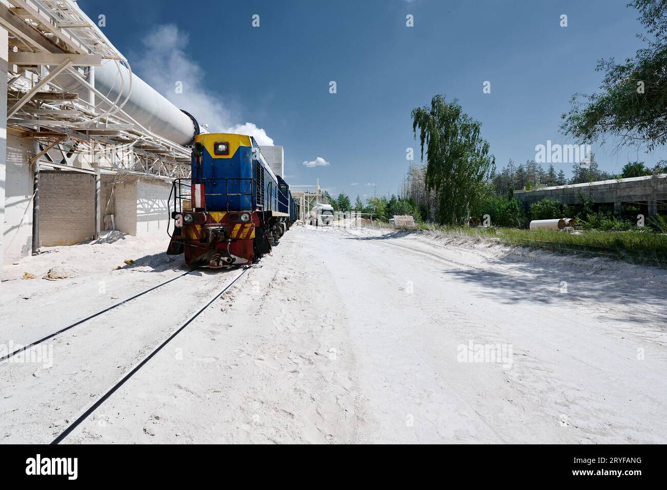 Shunting diesel locomotive moves cars at silica factory Stock Photo - Alamy