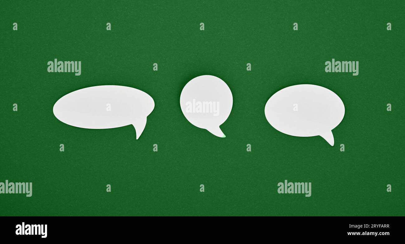 Three blank empty white paper callouts over green Stock Photo - Alamy
