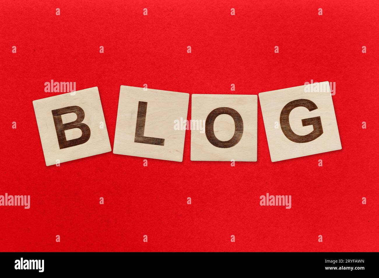 BLOG wooden letter sign on red paper Stock Photo - Alamy