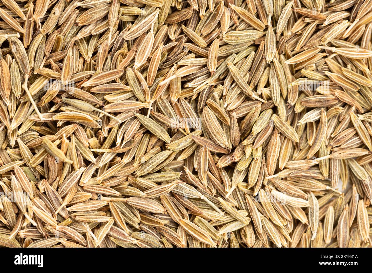 Cumin seeds background texture. Cuminum cyminum Stock Photo - Alamy