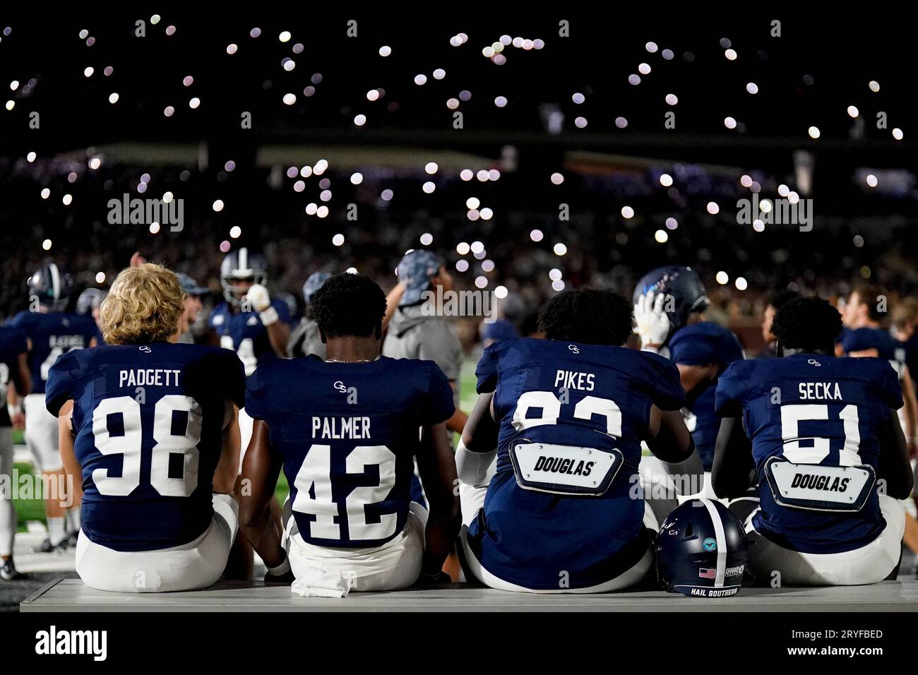 Georgia Southern players sit on the bench during the second half of an ...