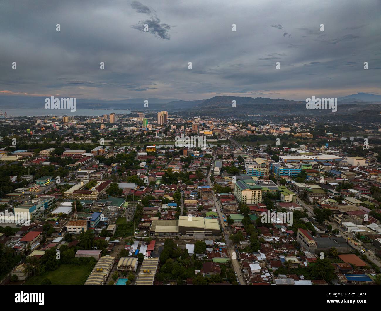 Flying over the buildings and village in Cagayan de Oro. Mindanao ...