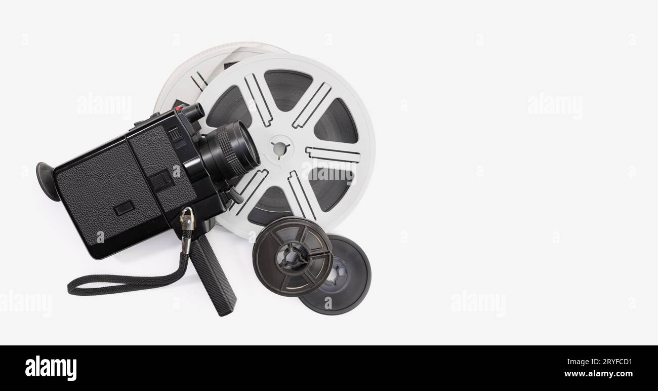 Vintage super 8 camera and film reels on white background. Movie film background. Copy space ...