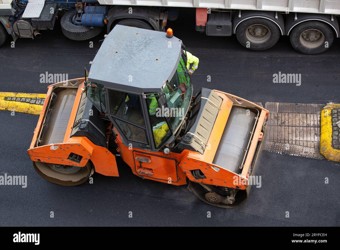 Asphalt roller at work. Construction of new roads, repair of pavement ...