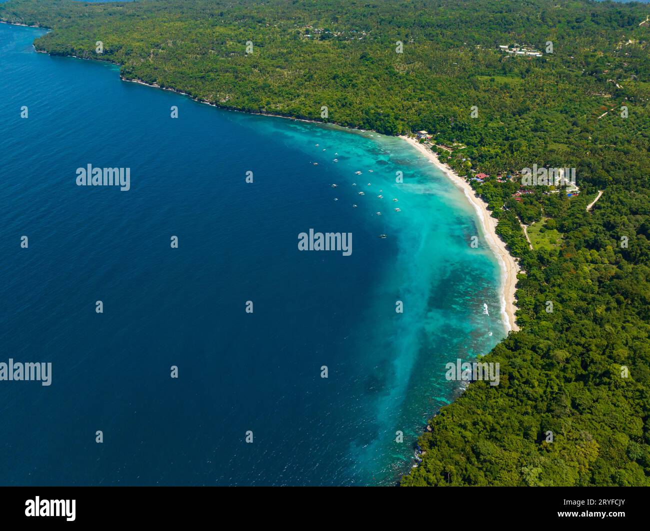 Drone view of beach resort with white sand and blue sea. Samal Island ...