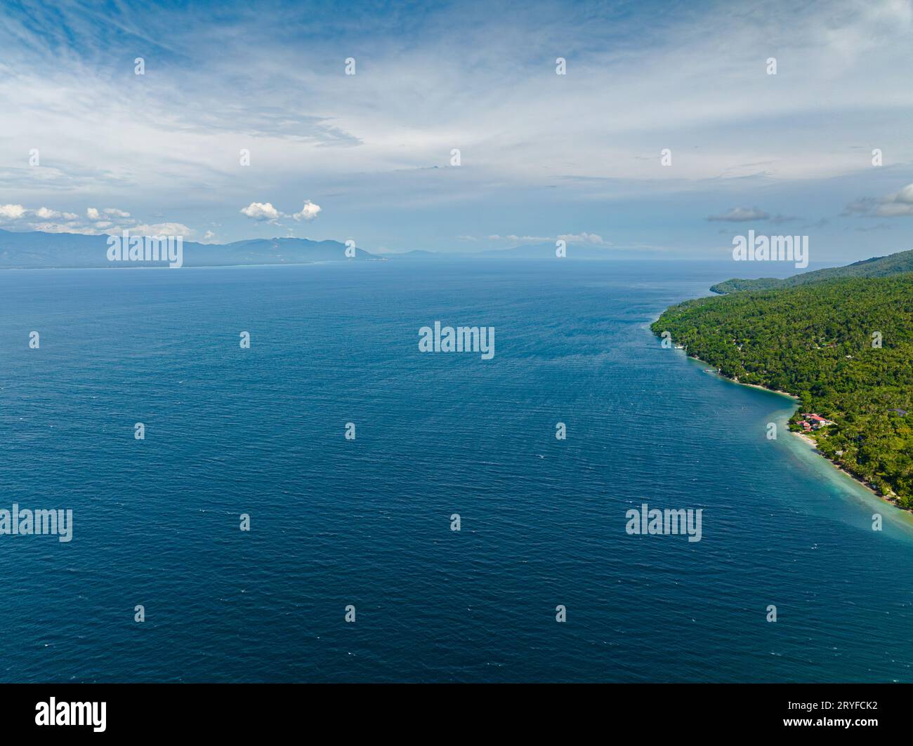 Tropical island and deep blue sea and waves. Samal Island. Davao ...