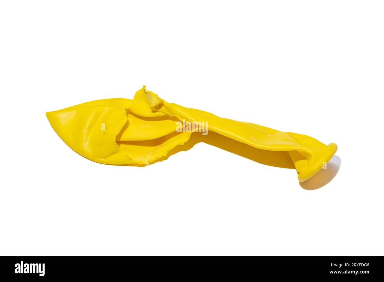 Popped balloon isolated on white background Stock Photo - Alamy