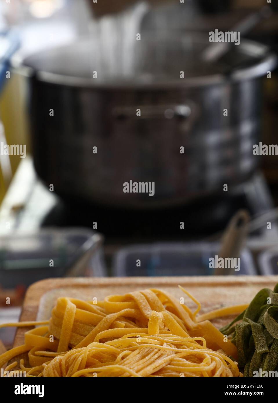 Cooking traditional Italian tagliatelle pasta Stock Photo - Alamy
