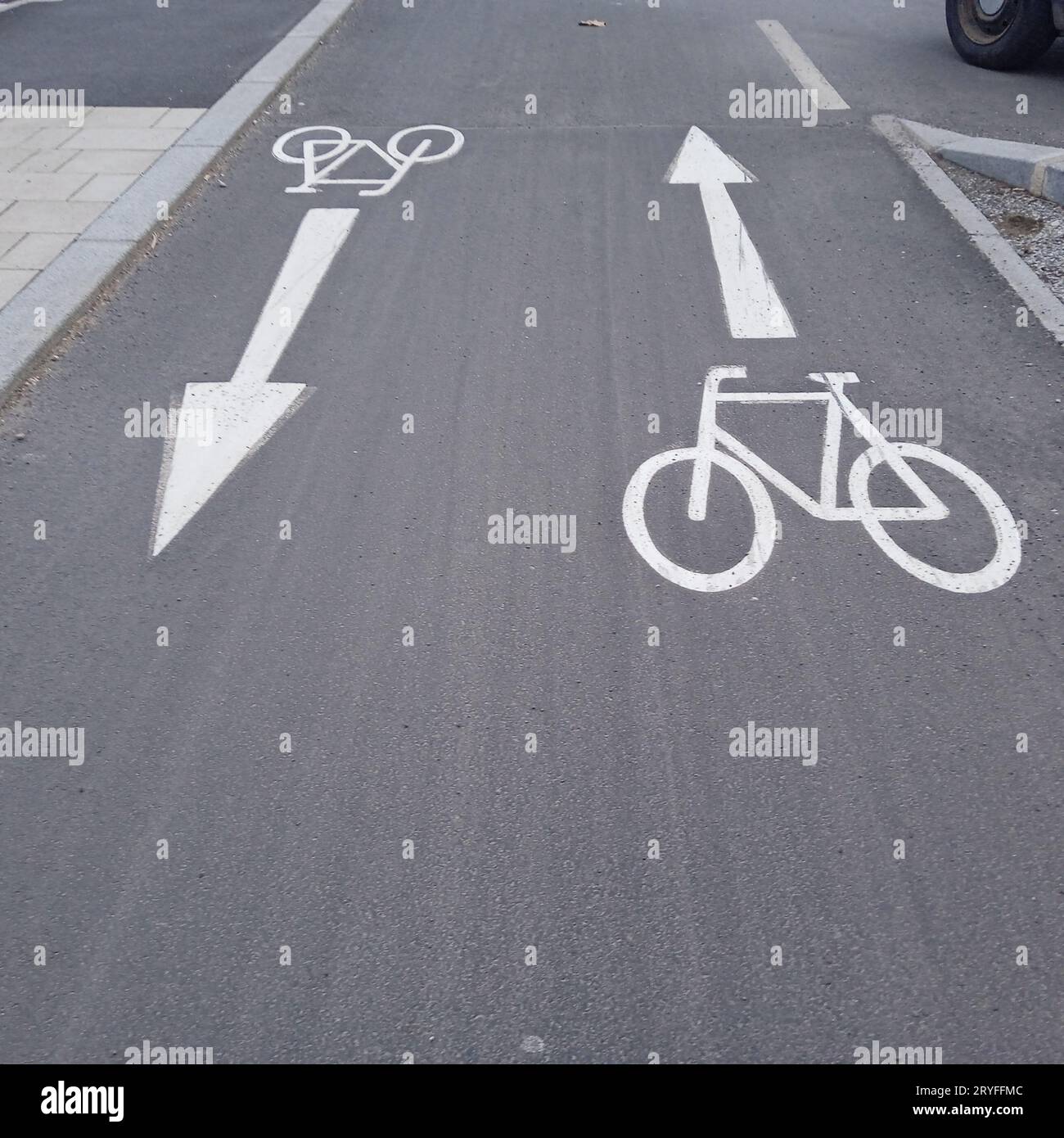 Bicycle path marking on the street Stock Photo - Alamy