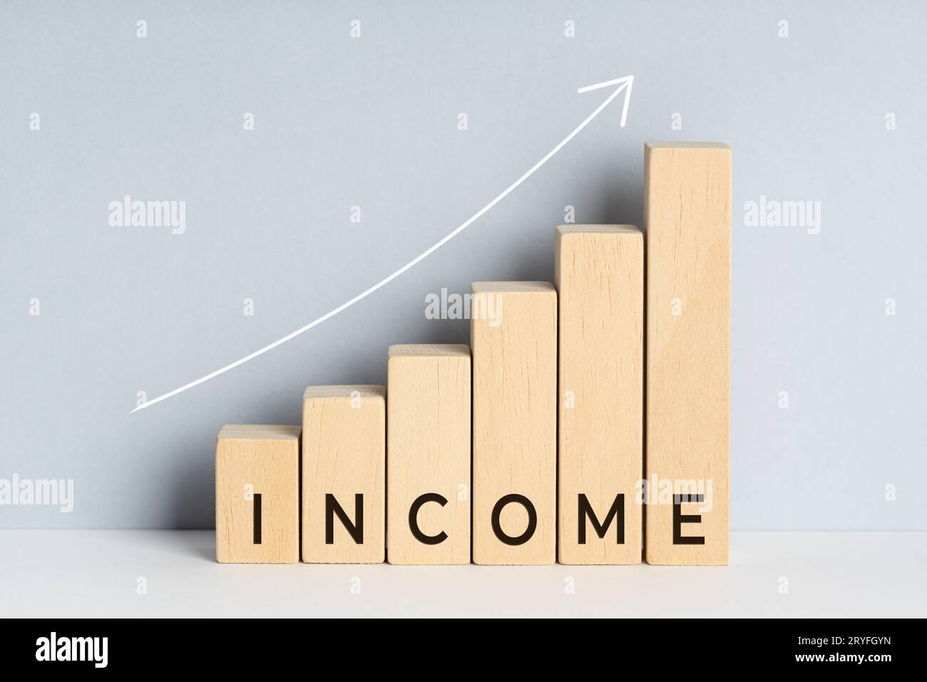 Income growth concept. Wooden block bar chart graph with text and ...