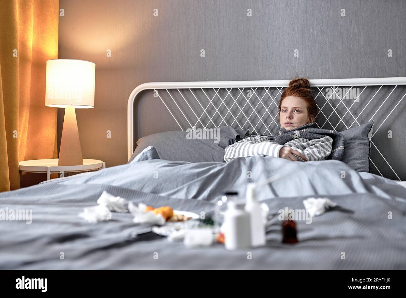 sick unhealthy serious pale woman lying in bed, closeup portrait, tired ...