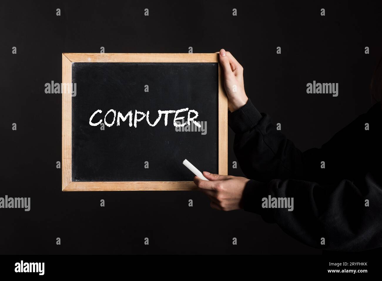 Computer on a blackboard sign Stock Photo - Alamy