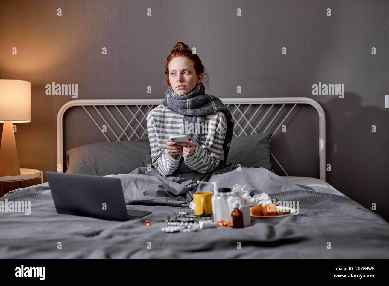 serious pensive seek pale ginger girl thinking to call doctor or not ...