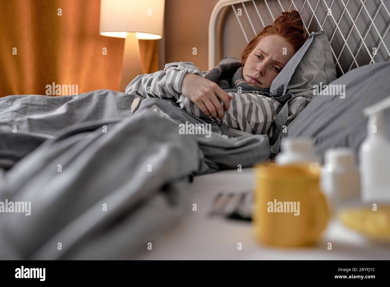 unhealthy depressed ginger without force woman lying in bedroom, lonely ...