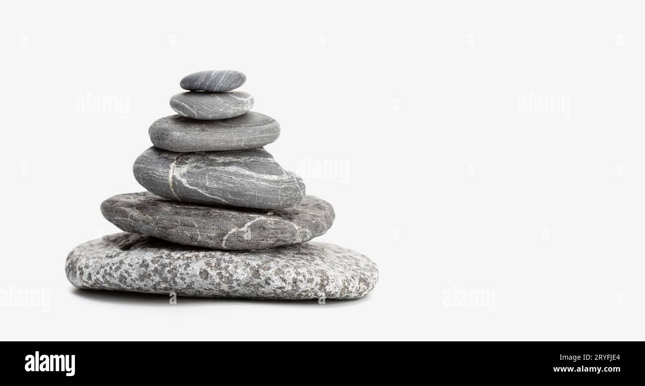 Balanced Stones isolated on white background with copy space. Balancing ...