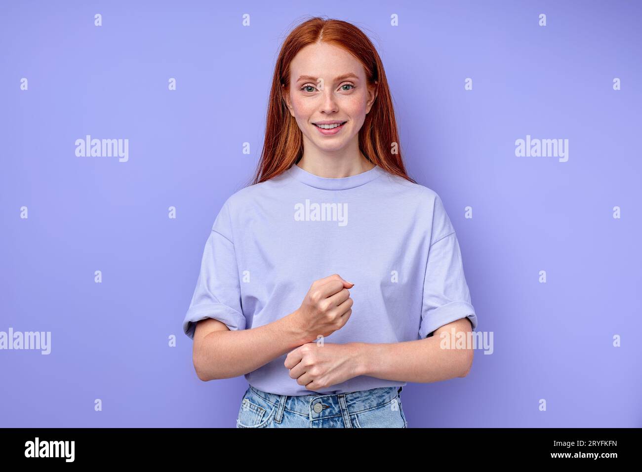 young red-haired happy girl working as a Sign language interpreter ...