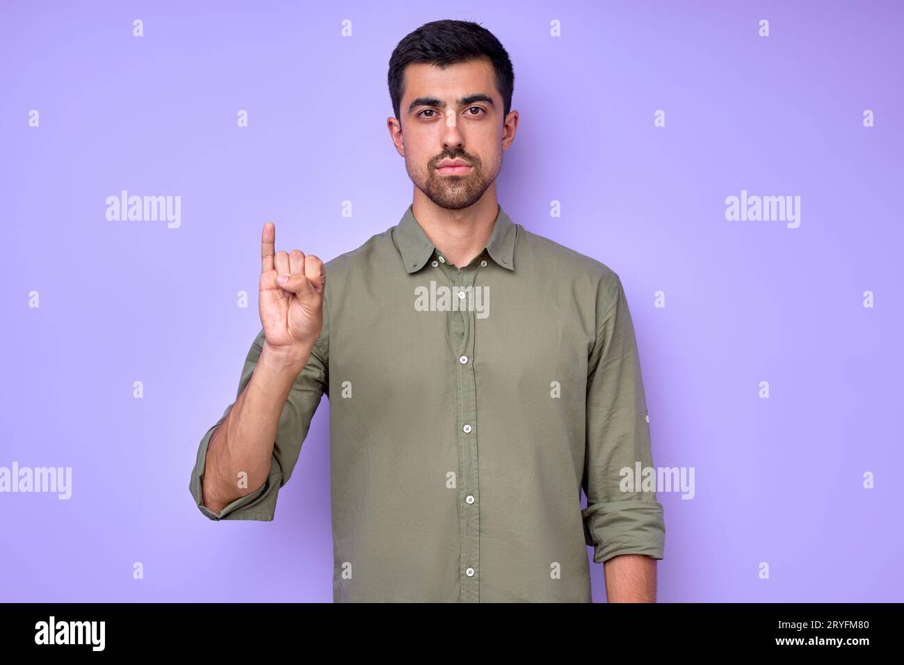 serious handsome man showing letter Ii with fingers .the Alphabet in ...