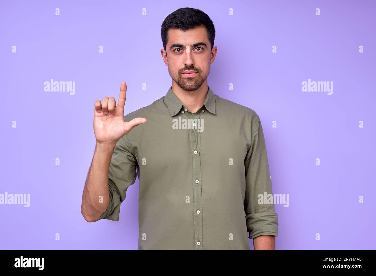 serious handsome man showing letter L l with fingers .the Alphabet in ...