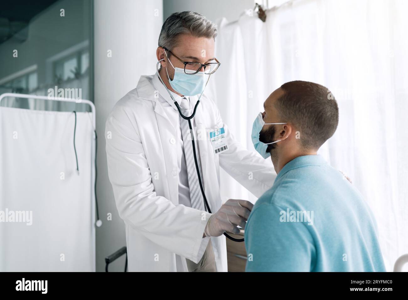 Doctor, stethoscope and patient in face mask for cardiology exam ...