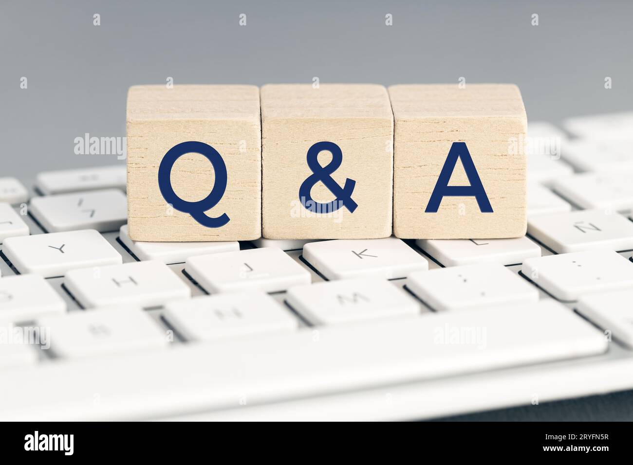Q&A word on wooden block on computer keyboard. Questions and answers ...