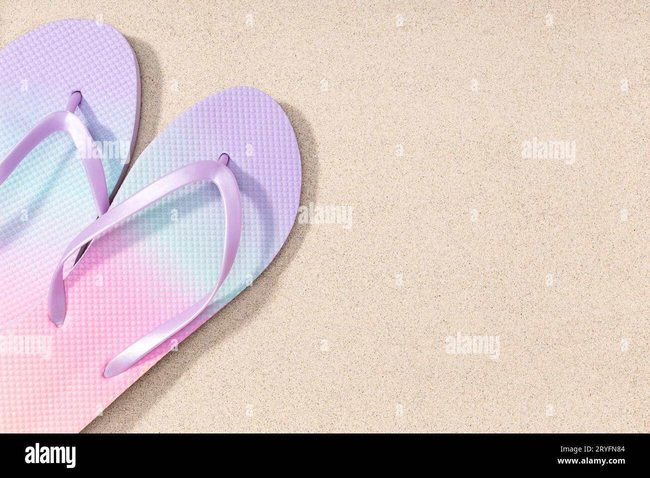 Summer background with fashion flip flops on beach sand background ...