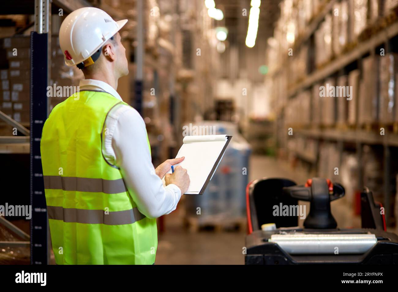 Manager man worker doing stocktaking of product management on shelves ...