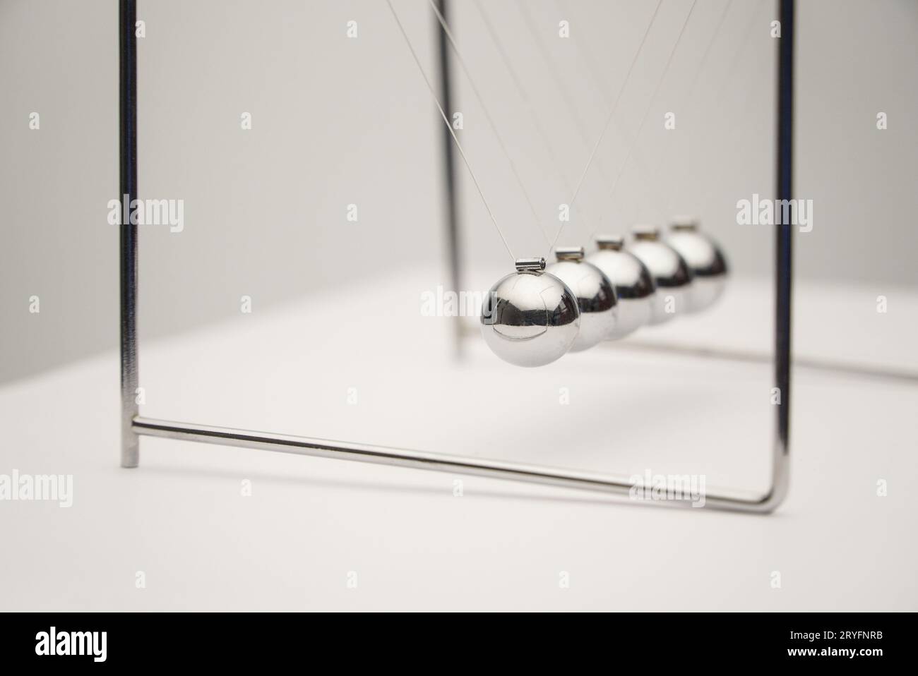 Newtons cradle concept hi-res stock photography and images - Alamy