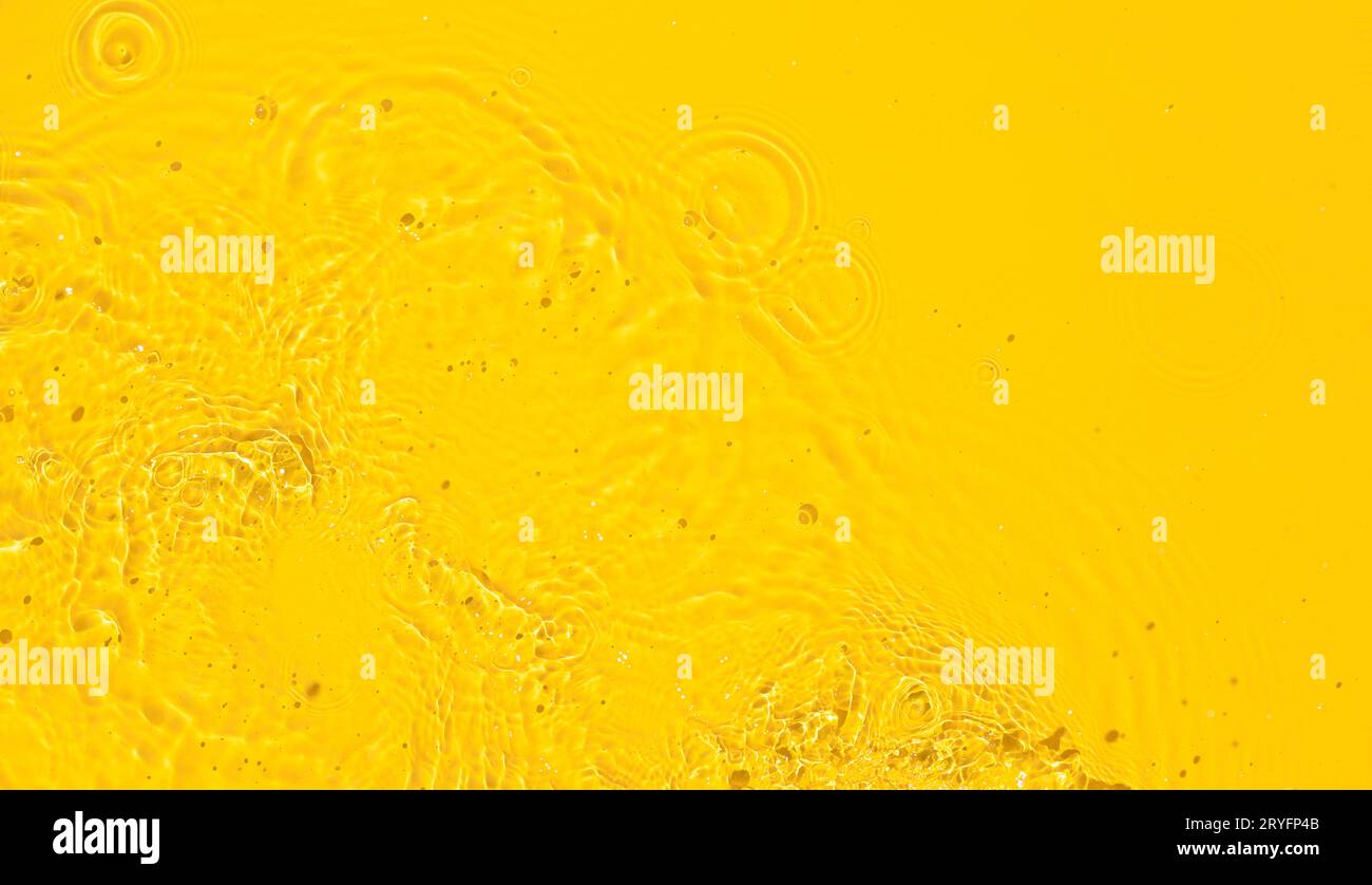 Abstract summer background. Transparent yellow clear water surface ...