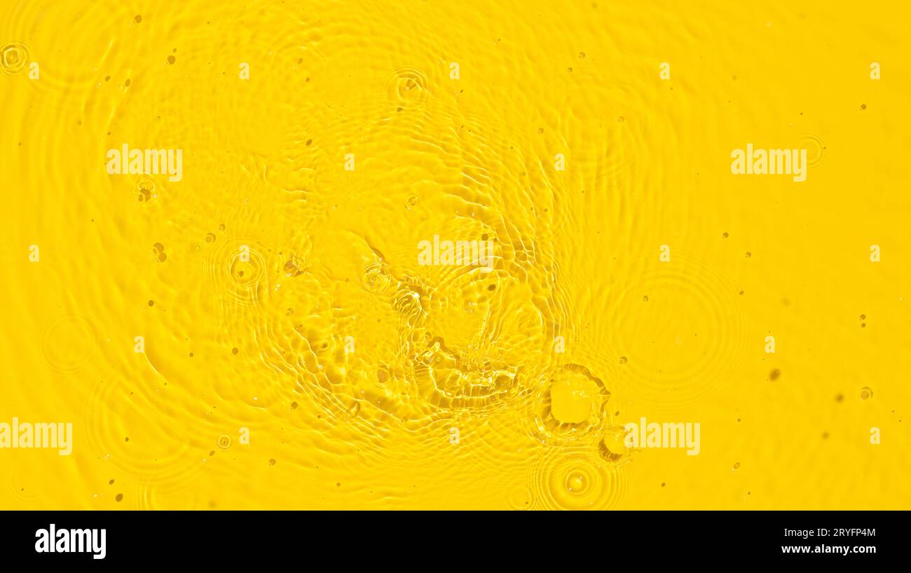 Abstract summer background. Transparent yellow clear water surface ...