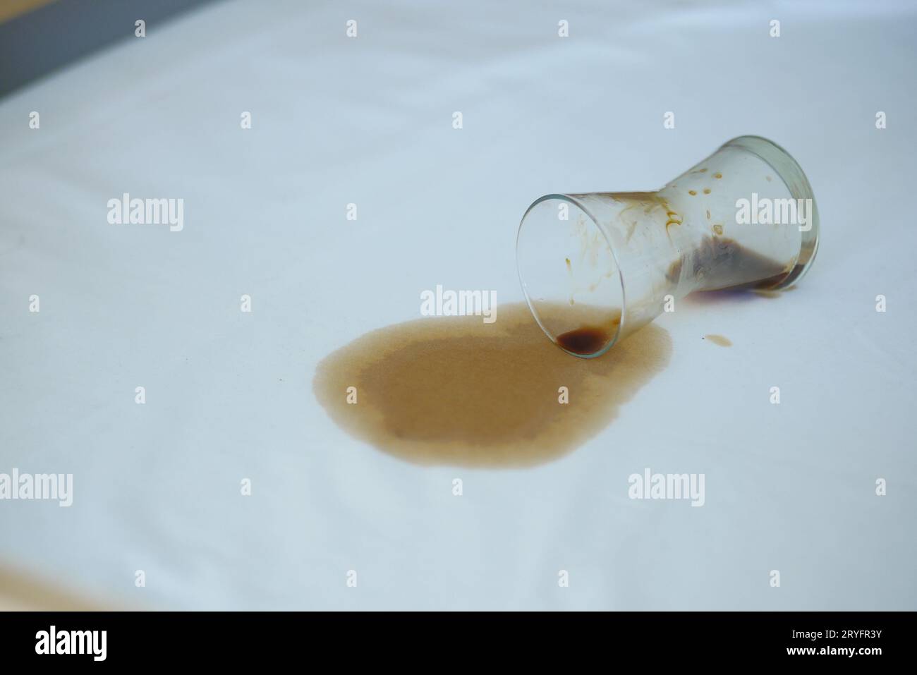 cup of coffee spilled on bed Stock Photo - Alamy