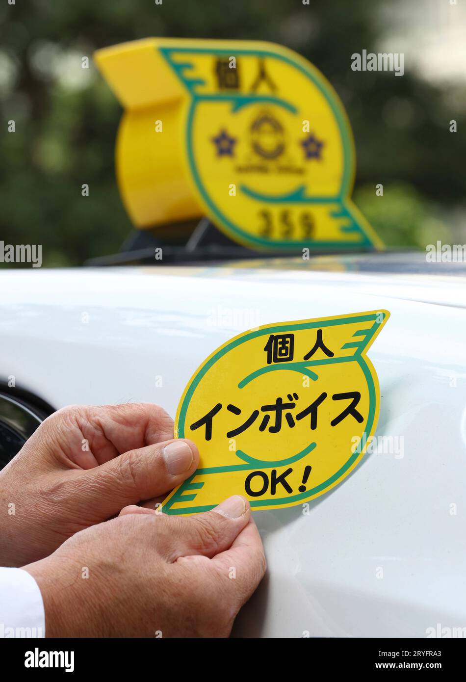 A private taxi is put a sticker showing that corps the invoice system ...