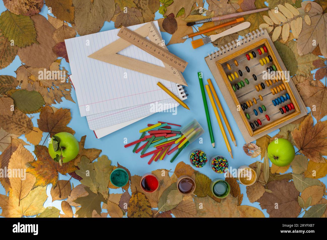 Top down flat lay representing the idea of going back to school. Mock ...